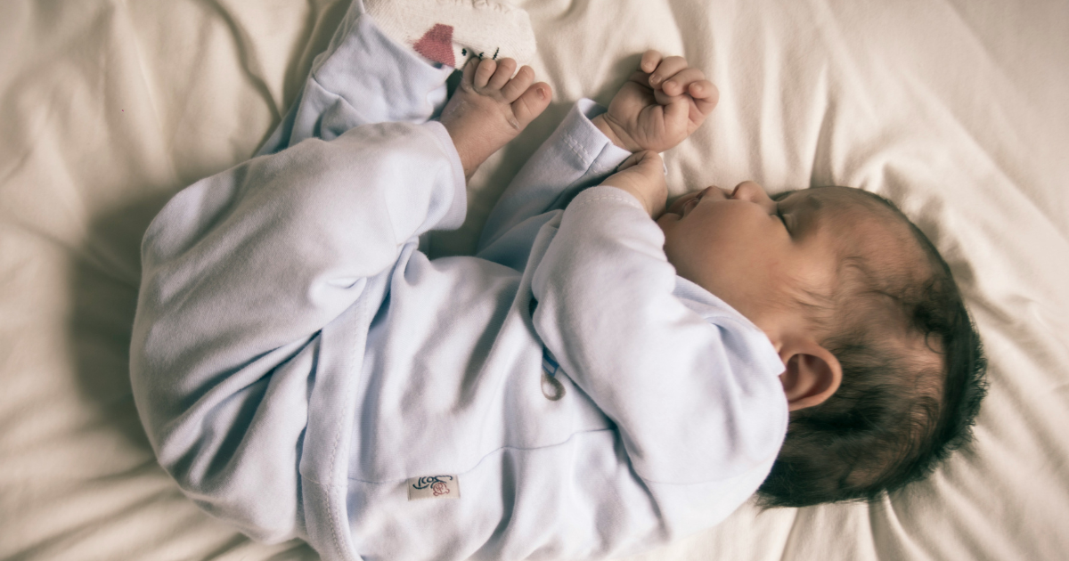 My Baby Keeps Rolling Over in Sleep and Waking Up - Urban Parenthood